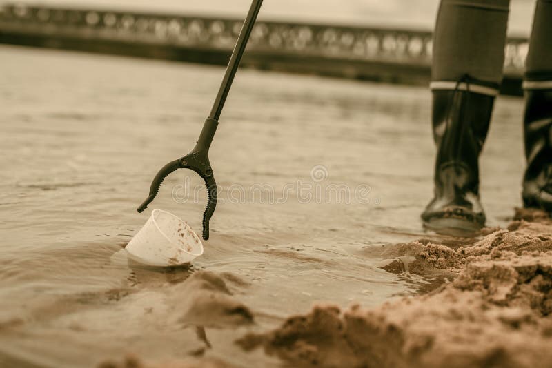Collecting Plastic Garbage with a Pair of Pliers Stock Photo - Image of ...