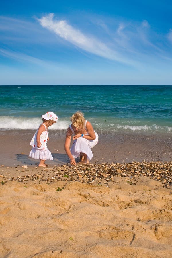 Collecting seashells stock photo. Image of collecting - 3327156
