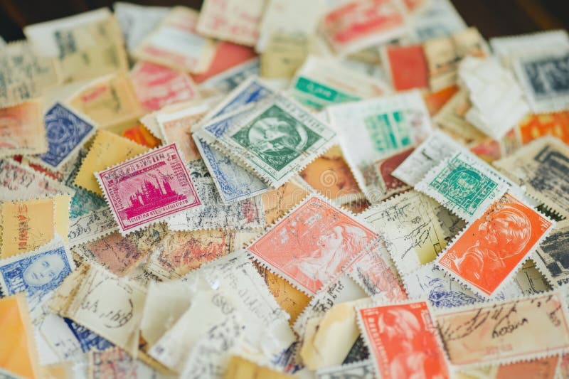 Collecting Vintage Postage Stamps in a Colorful Array on a Wooden ...