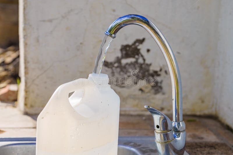 Collecting Water with Plastic Water Bottle Stock Photo - Image of camp ...
