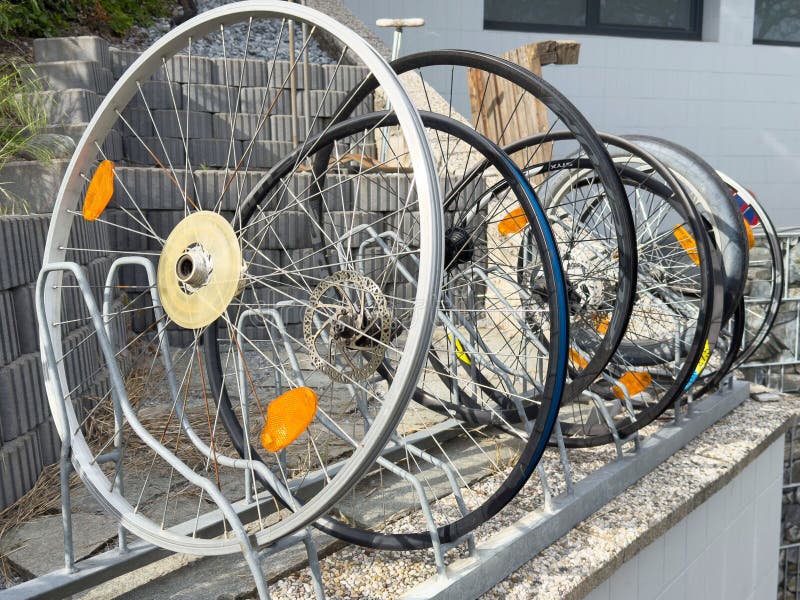 Collection of Bicycle Wheels and Tires in Rack Outdoors Editorial Stock ...
