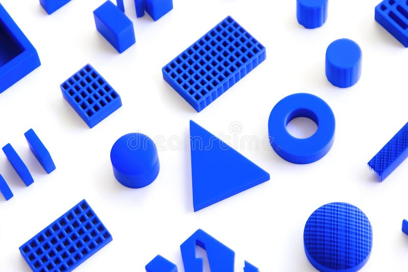 A Collection of Blue Plastic Shapes on a White Surface for Various Uses ...