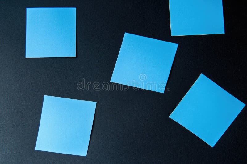 A Collection of Blue Sticky Notes Placed on a Dark Background Stock ...