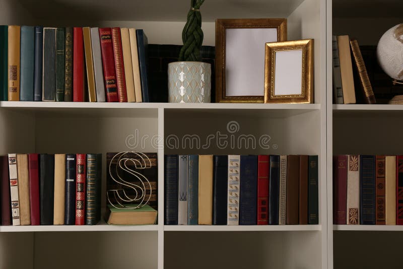 Collection of Books and Decor Elements on Shelves. Home Library Stock ...