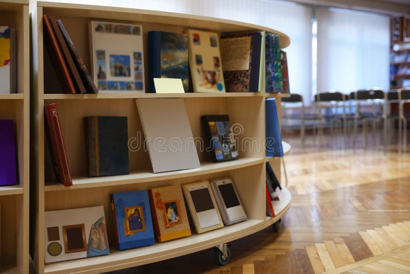 Collection of Books on Display Stand in Library Editorial Image - Image ...