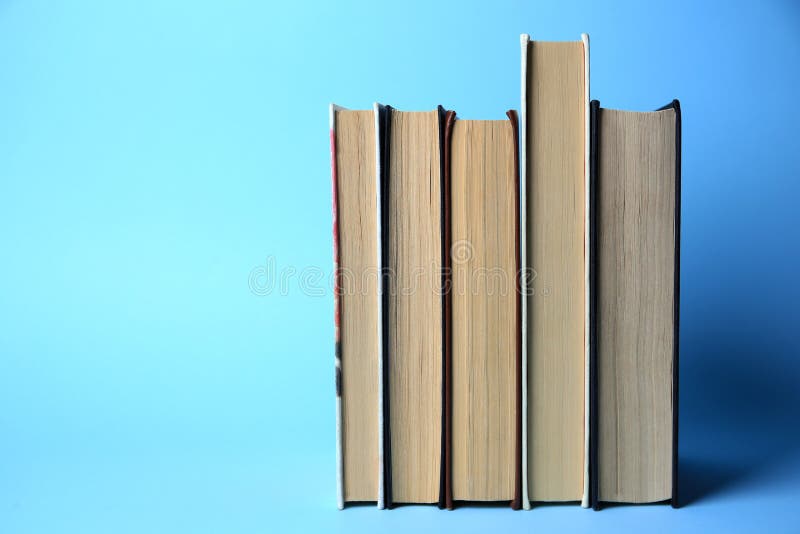 Collection of Books on Light Blue Background, Space for Text Stock ...