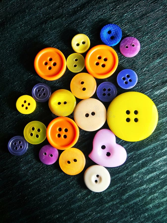 Big and Small Colored Buttons on Black Stock Image - Image of black ...