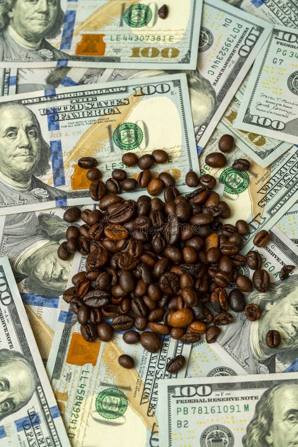 Coffee Beans Scattered on Hundred Dollar Bills in a Unique Arrangement ...