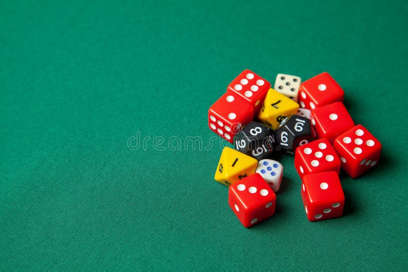 Collection of Colored Gaming Dice Cubes on Green Table. Copy Space for ...