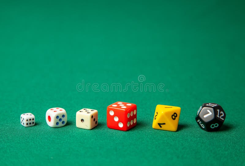 Collection of Colored Gaming Dice Cubes on Green Table. Copy Space for ...