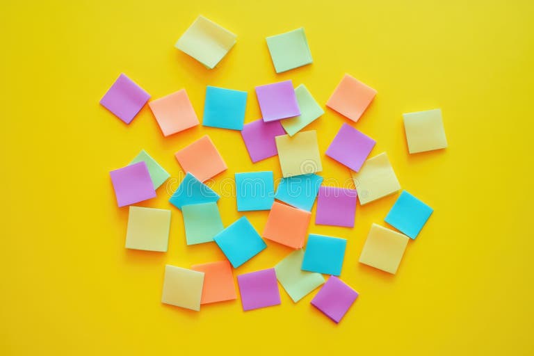 A Collection of Colorful Post-it Notes Stuck To a Bright Yellow Surface ...