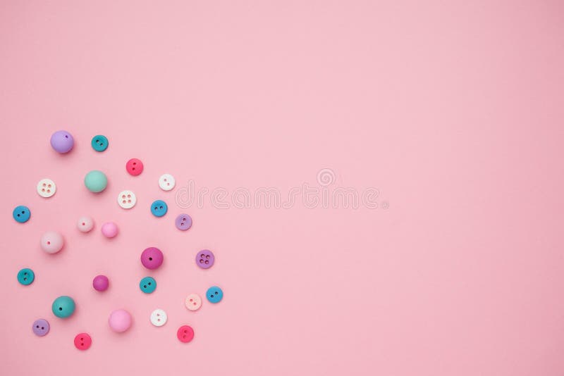 Collection of Colourful Sewing Buttons on Pink Background with Copy ...