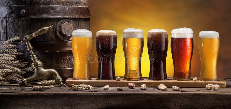 Collection of Different Chilled Beer on Wooden Table. Cellar Interior ...
