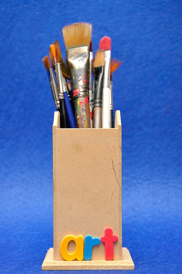 A Collection of Different Size Paint Brushes in a Wooden Container with ...