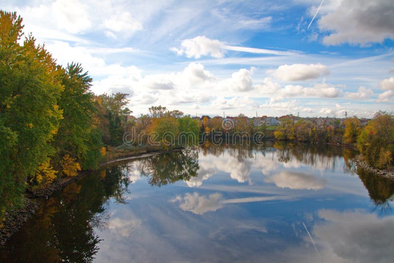 Dramatic Clouds Reflected in the Rideau River Stock Photo - Image of ...