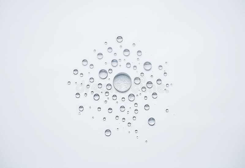 A Collection of Droplets Forming a Pattern on a White Sheet Stock Image ...