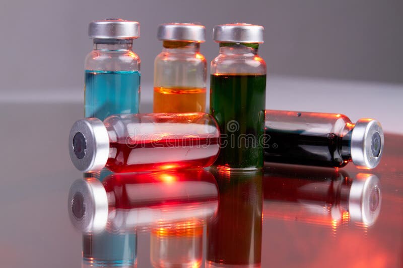 Collection of Drug Vials with Colored Solution. Stock Image - Image of ...