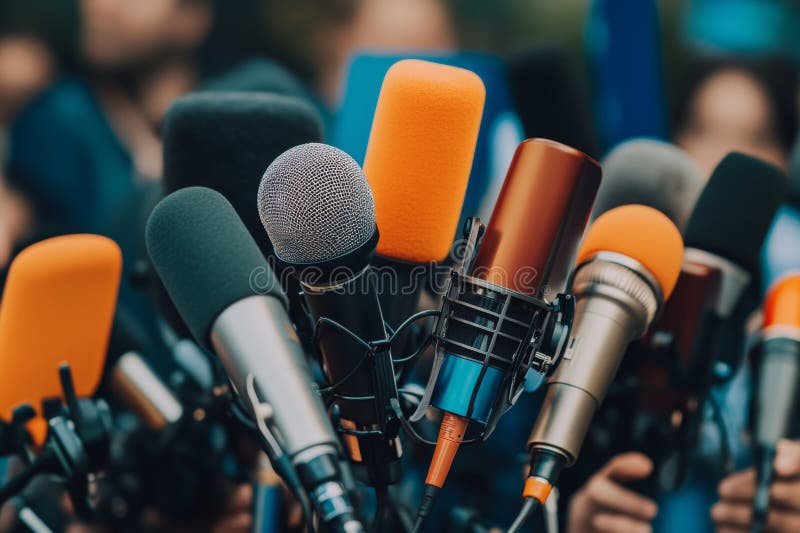 A Collection of Dynamic Microphones in Various Colors at a Press Event ...