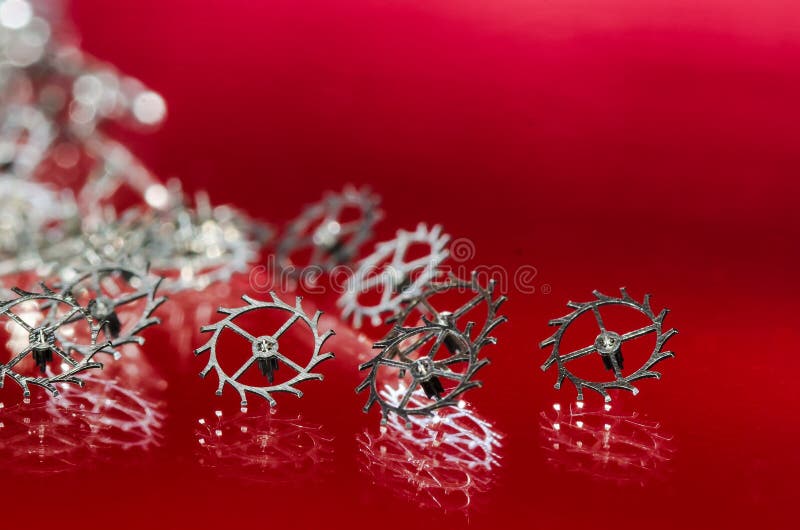 Collection of Escape Wheels Resting in a Red Surface Stock Photo ...