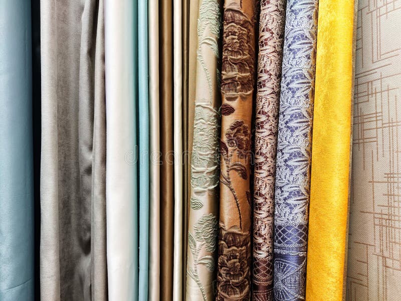 Collection of Fabrics at the Store Counter. View of Rolls of Fabric in ...