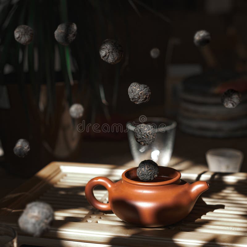 A Collection of Floating Tea Leaves Gracefully Hover Above a Teapot in ...