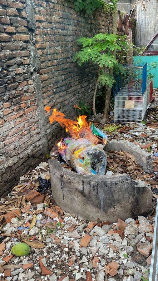 A Panoramic View of the Garbage Being Burned Behind the House Near the ...