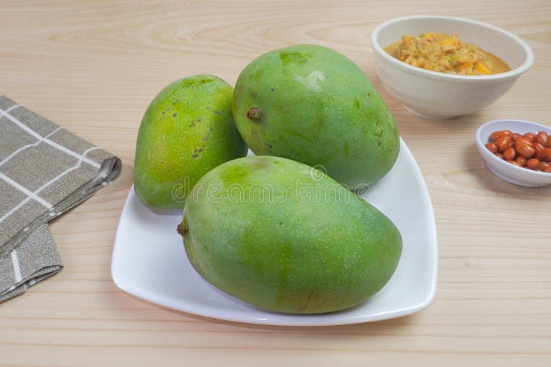 Collection of Green Mangoes on the Table. Stock Image - Image of ...