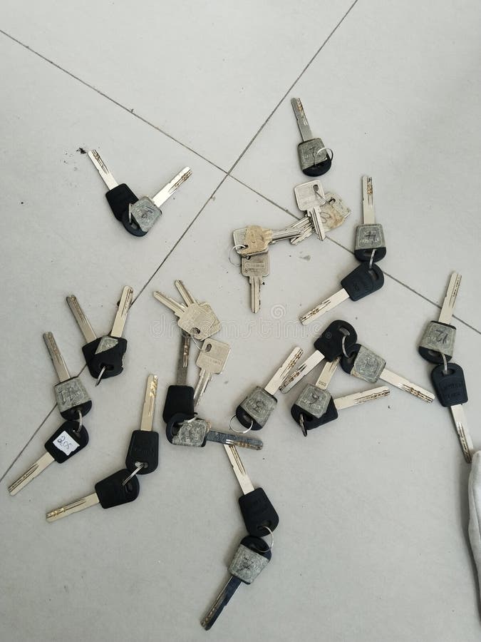 A Collection of Keys on the Floor Stock Photo - Image of white ...