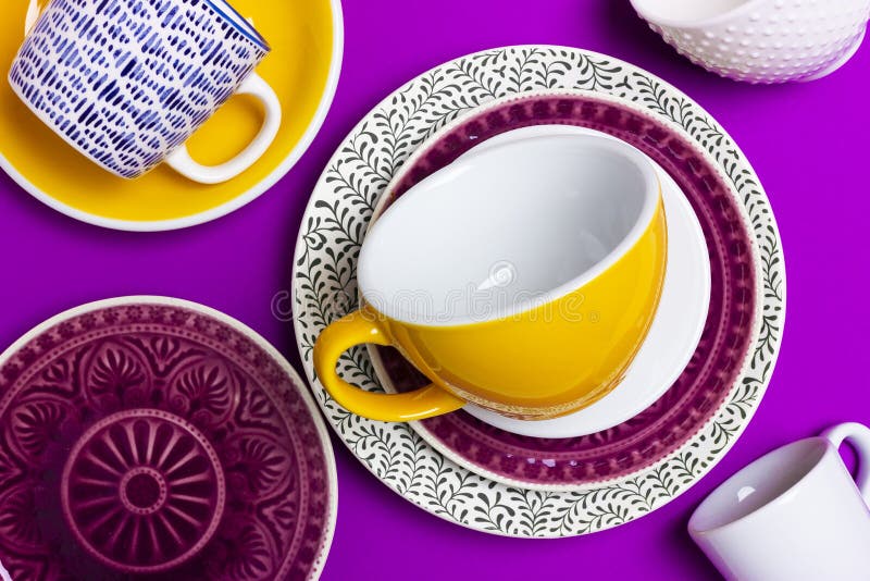 A Collection of Many Different Multi-colored Mugs and Tableware Stock ...