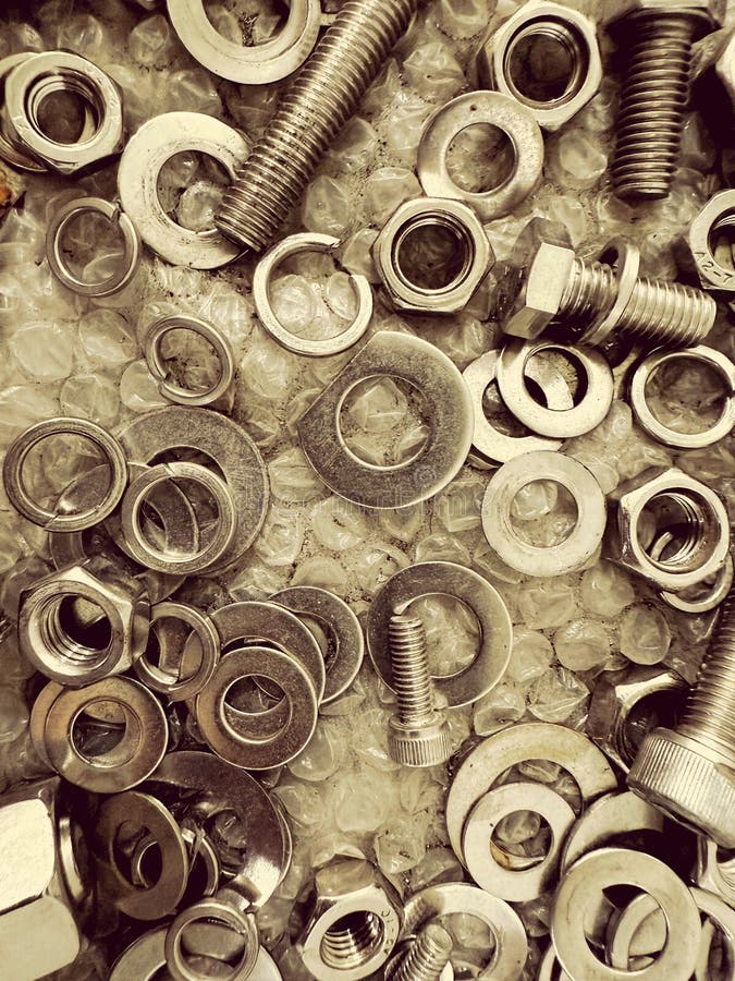 Metal Bolts, Nuts and Washers on Grey Background. Top View. Stock Photo ...