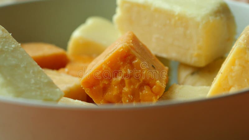 Collection of Multi Color Cheese in a Bowl on Table Stock Video - Video ...