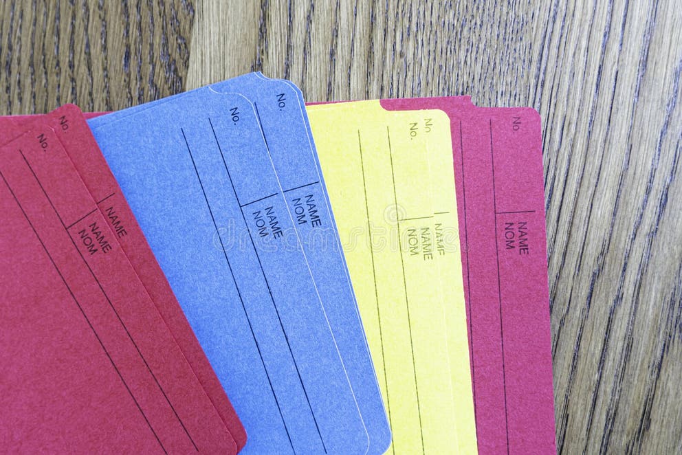 Collection of Multi Colored File Folders on a Table Stock Photo - Image ...