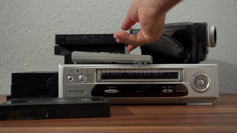 Collection of Old Electronics Including a VHS Player and VCR. Stock ...
