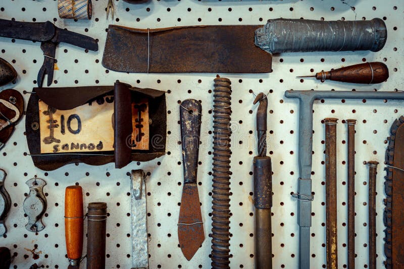 A Collection of Old Hand Tools Arranged on the Wall Stock Image - Image ...
