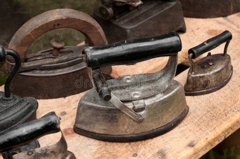 Collection of Old Irons on Yellow Background. Stock Photo - Image of ...