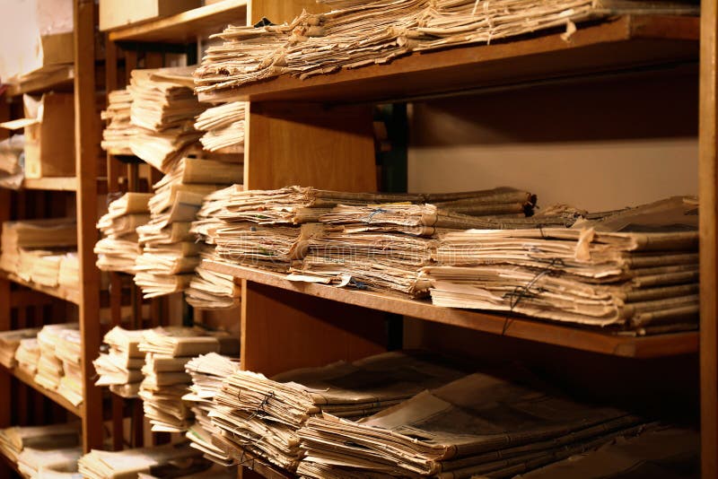 Collection of Old Newspapers on Shelves in Library Stock Image - Image ...
