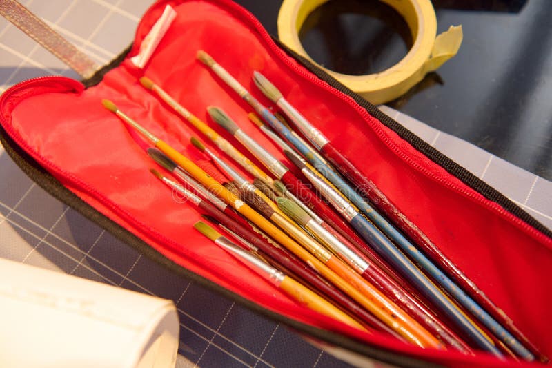 Collection of Paintbrushes in Red Case on Work Table in Art Workshop ...