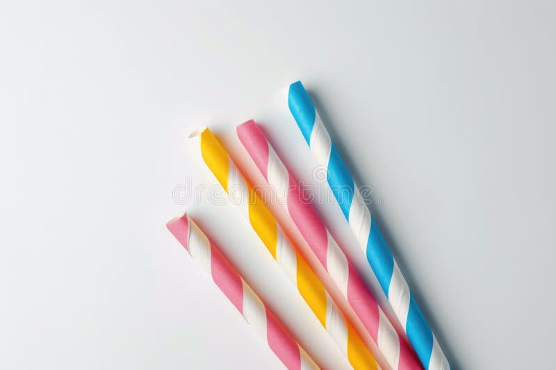 A Collection of Paper Straws Sitting on a Flat Surface, Ready for Use ...