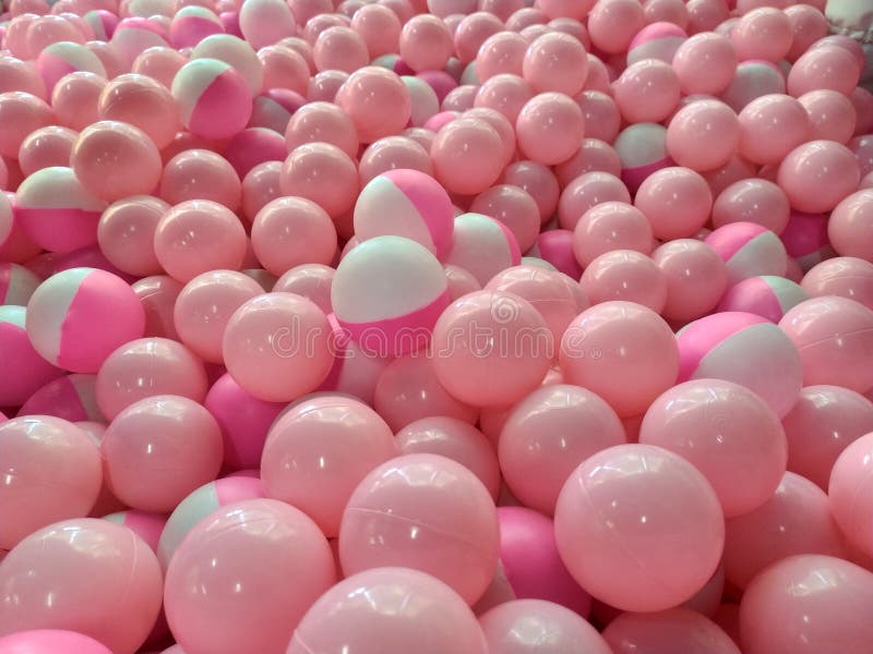 A collection of pink balls stock photo. Image of play - 277894848