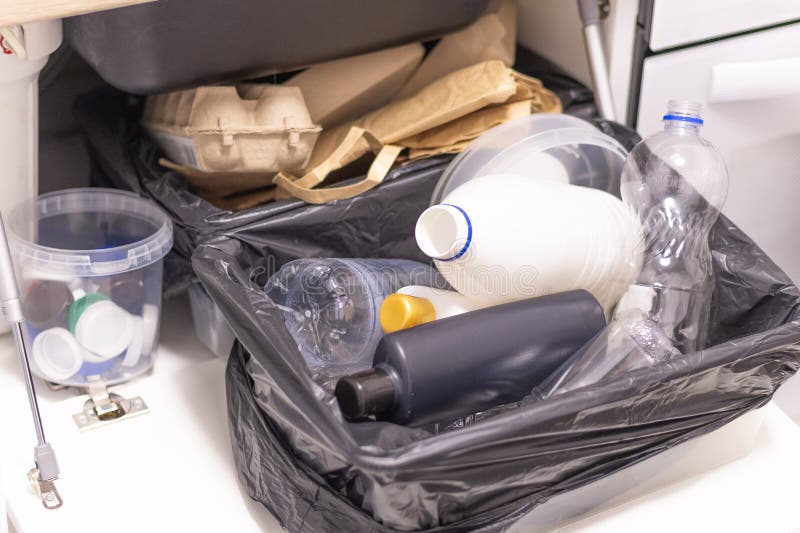 Sorting Plastic Waste at Home. Plastic Transparent Bottles are Selected ...