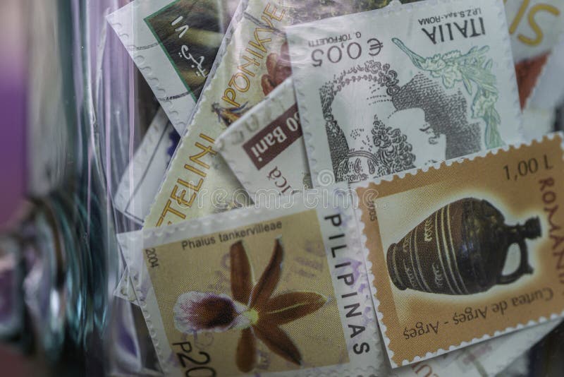 Collection of Postage Stamps in a Jar Editorial Stock Photo - Image of ...