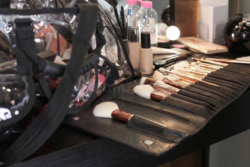 Collection of Professional Makeup Brushes on Table in Beauty Salon ...