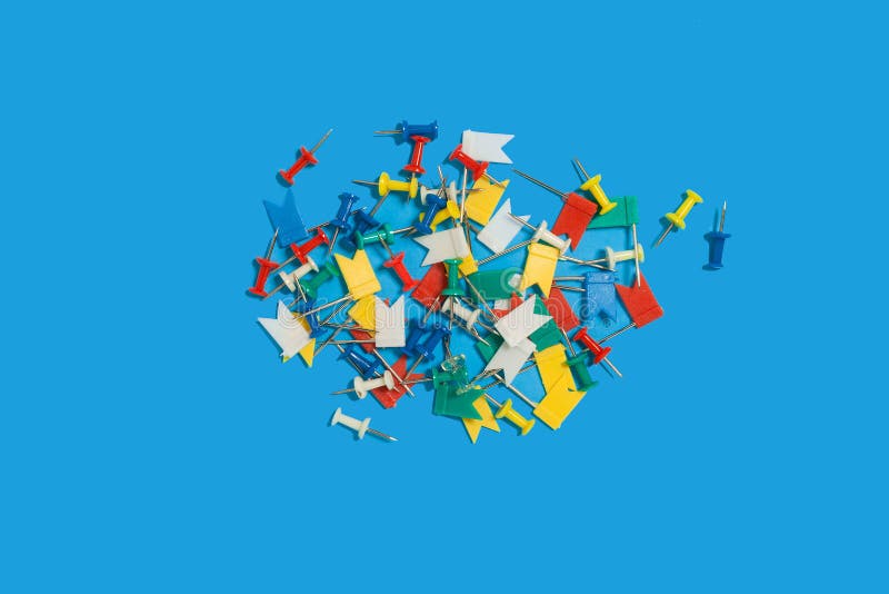 Collection of Pushpins and Pin Flags on a Blue Surface Stock Photo ...