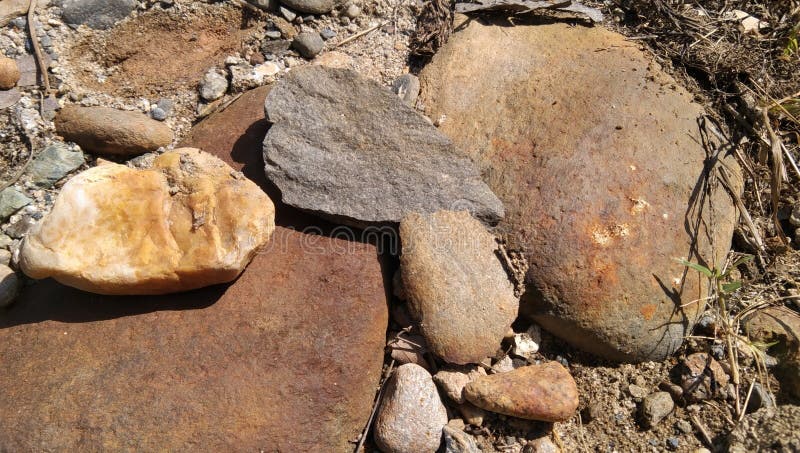 A Collection of Scattered Stones that Have Different Shapes Stock Photo ...
