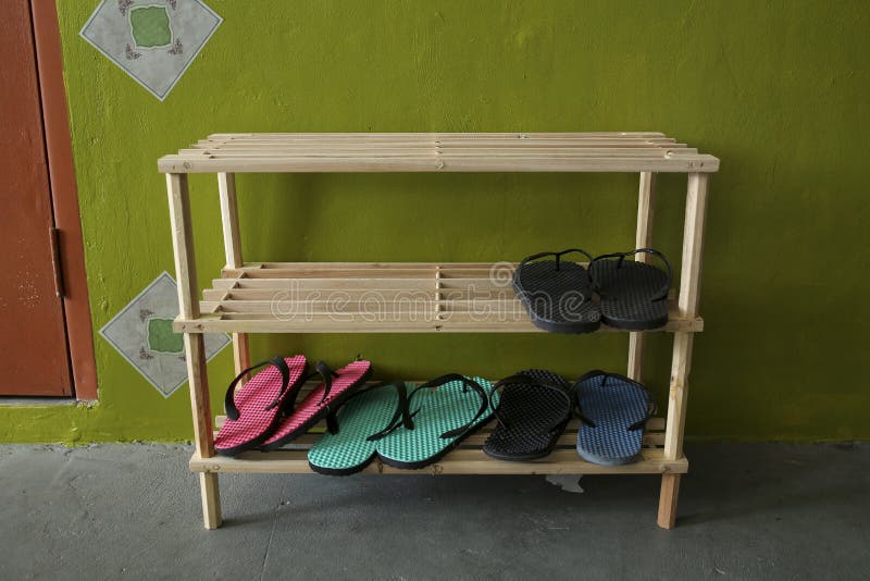 Collection of Slippers on Rack Storage. Stock Image - Image of colours ...