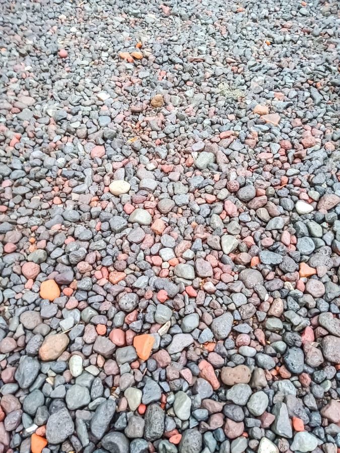 A Collection of Small Pebbles Scattered on the Ground Stock Image ...