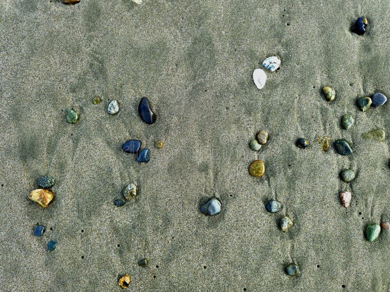 A Collection of Small Rocks on the Beach Stock Photo - Image of ...