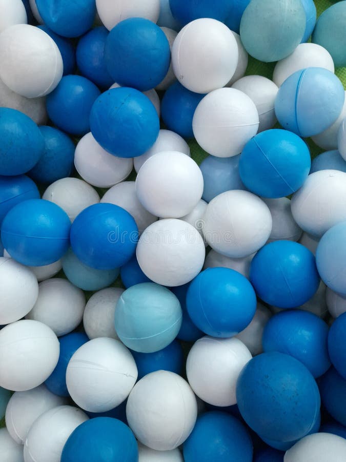 A Collection of Small White Balls Blue Stock Image - Image of glass ...