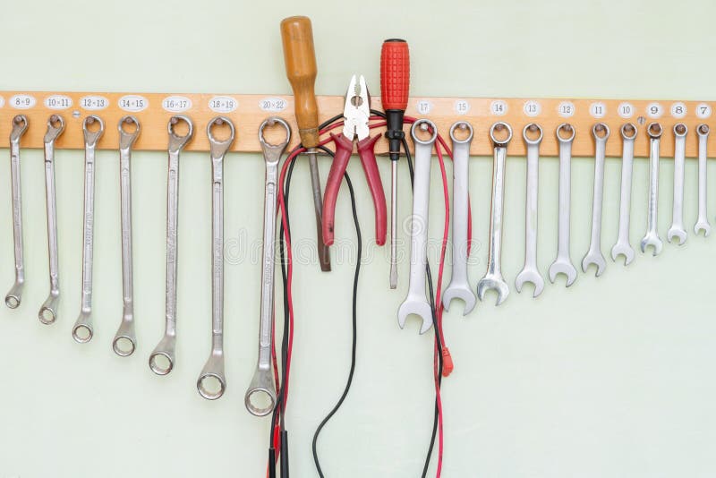 Collection of Spanners Hanging on the Wall on a Wooden Holders Stock ...