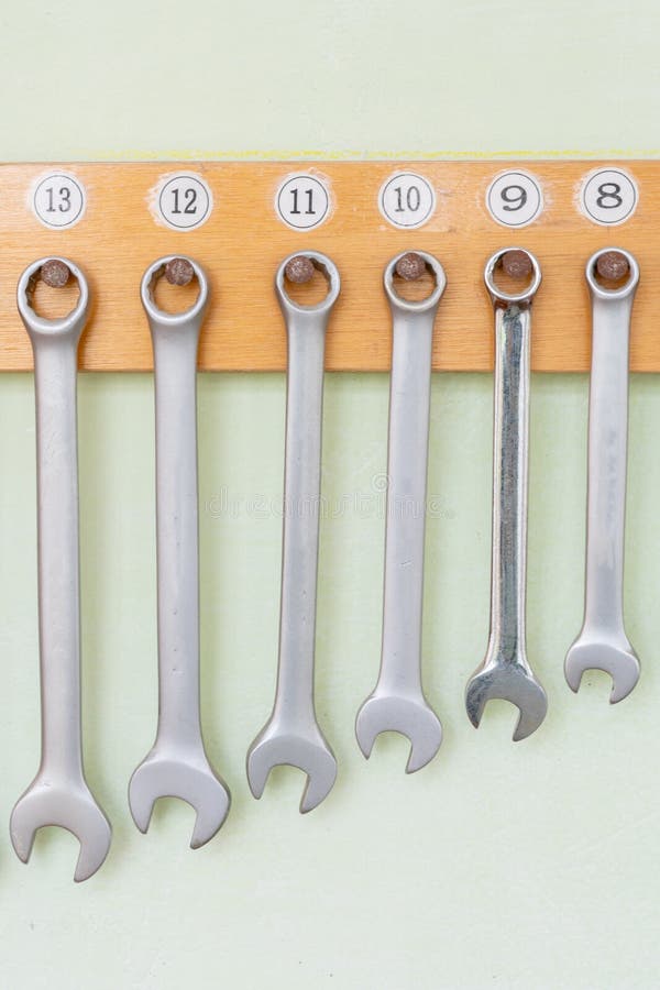 Collection of Spanners Hanging on the Wall on a Wooden Holders Stock ...